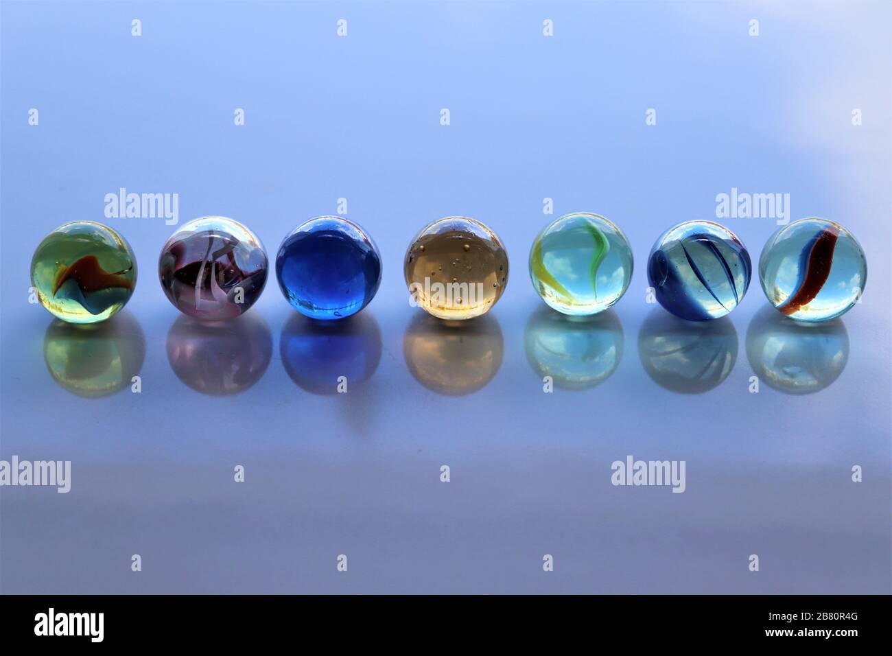 row of marbles Stock Photo - Alamy