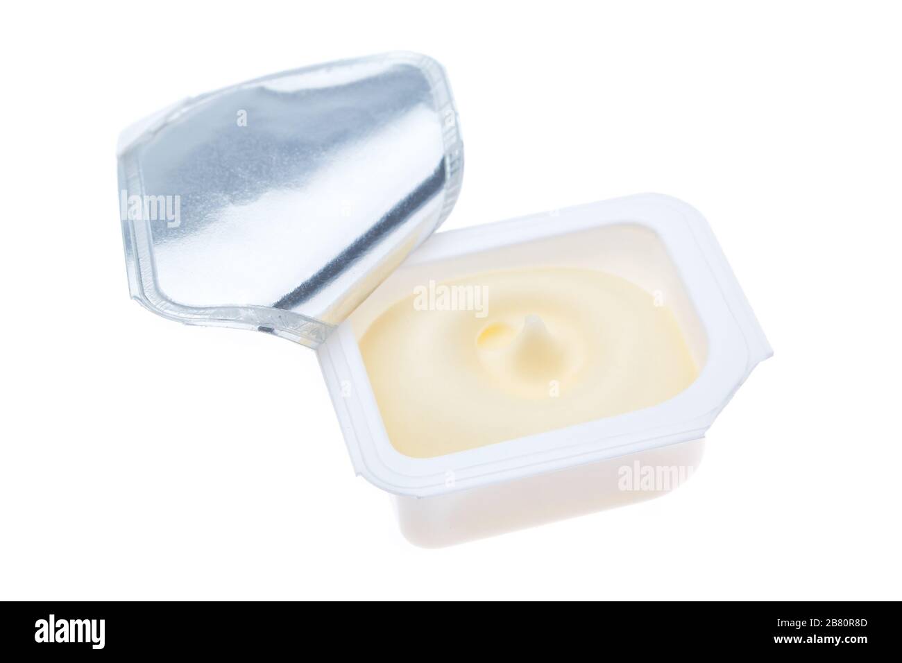 Open plastic packages of butter. On a white background Stock Photo - Alamy