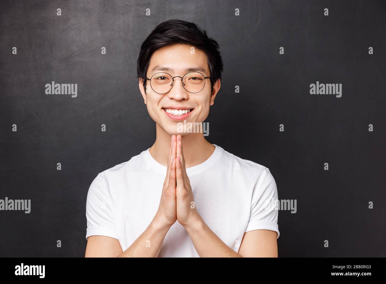 Close-up portrait of friendly, polite and relaxed young asian man with ...