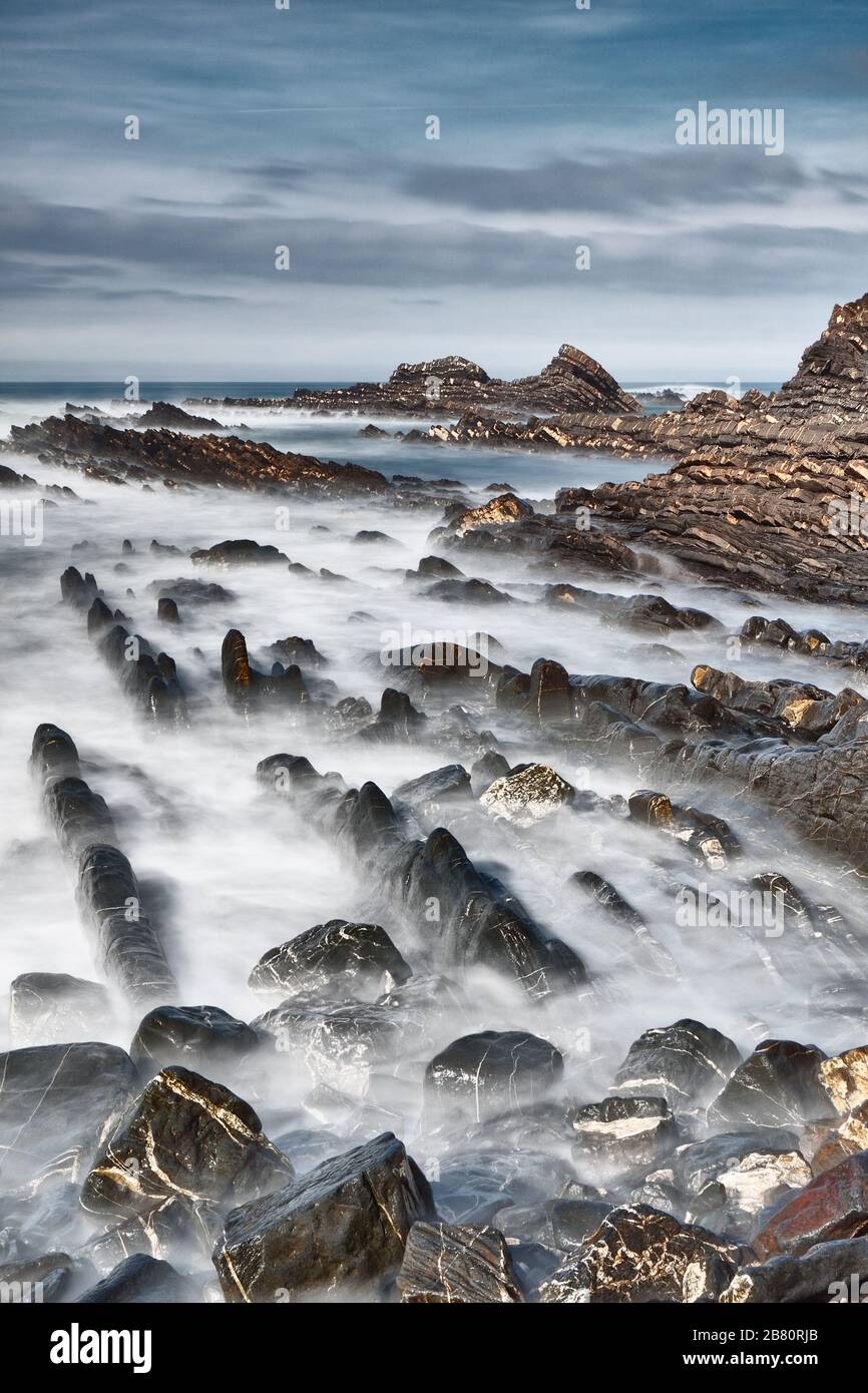 Beautiful seascape. Sea and rock at the sunset Stock Photo - Alamy