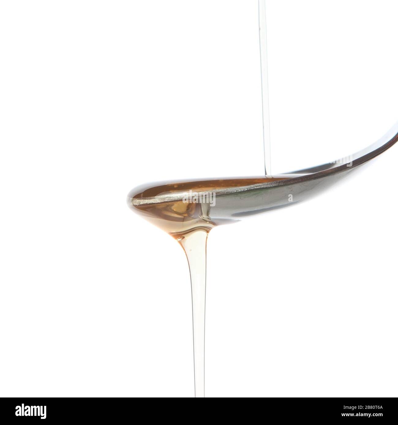 Olive oil flowing on spoon hi-res stock photography and images - Alamy