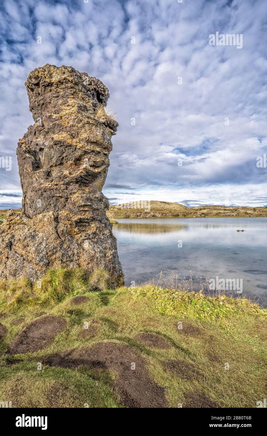 tranquil landscape with solitary lava monoliths at Lake Myvatn in ...