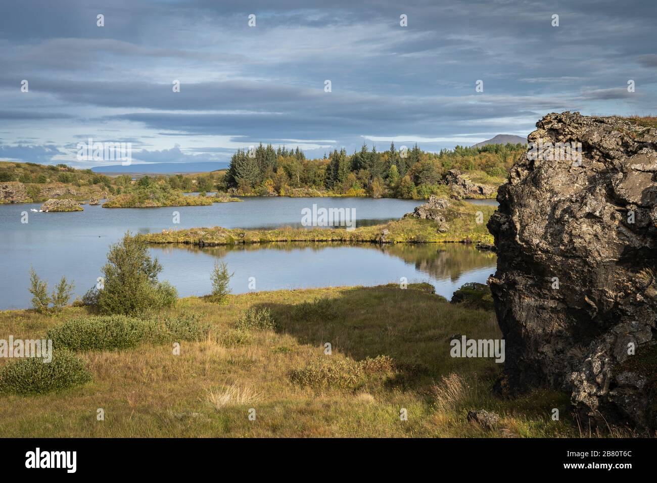 tranquil landscape with solitary lava monoliths at Lake Myvatn in ...