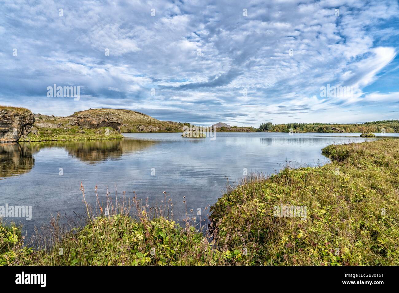 tranquil landscape with solitary lava monoliths at Lake Myvatn in ...
