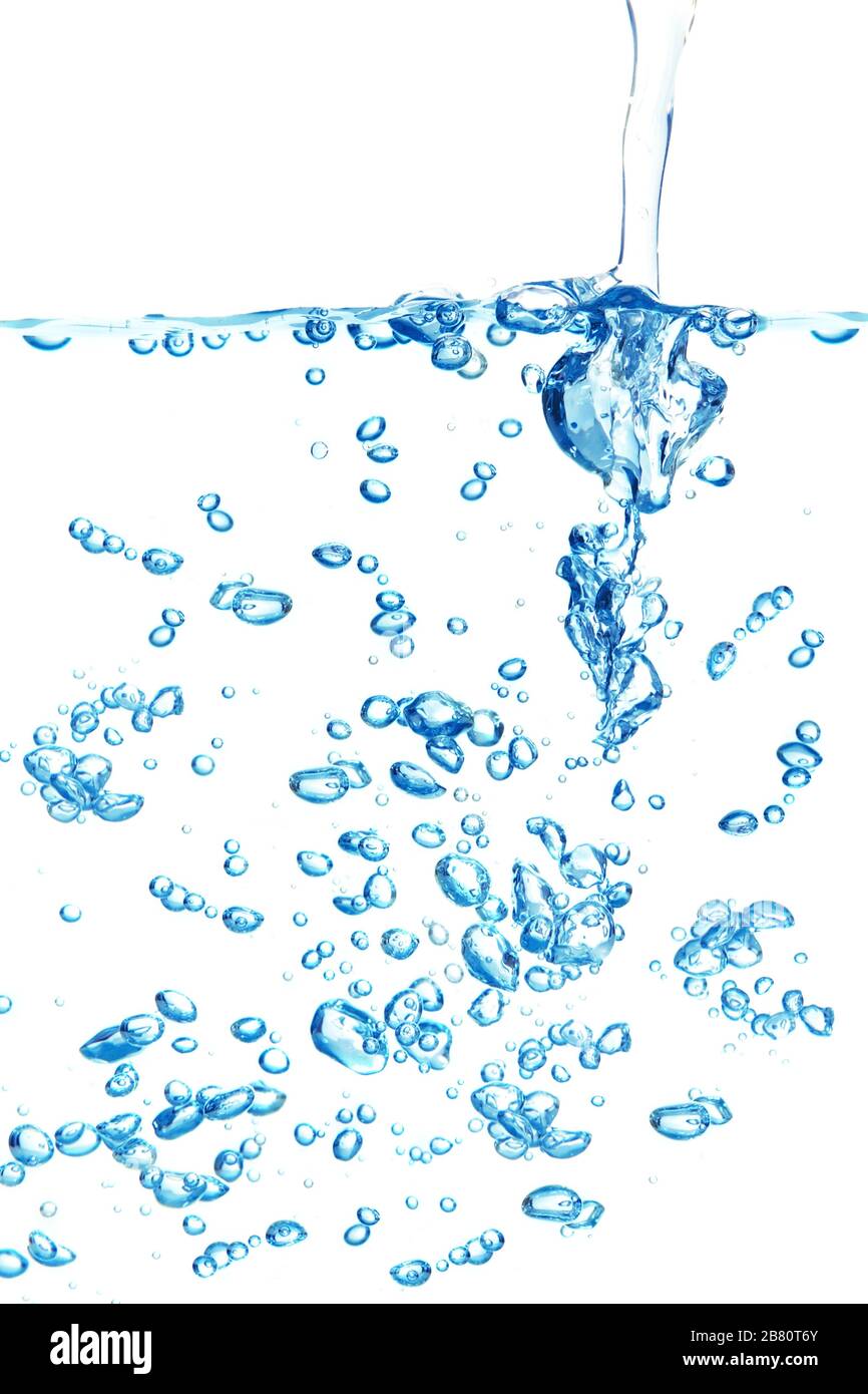 The blue jet of water with bubbles. Closeup Stock Photo - Alamy