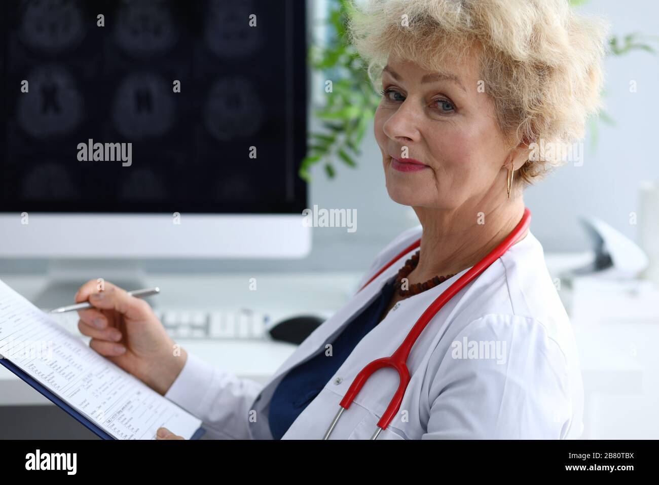 Therapist with stethoscope Stock Photo - Alamy
