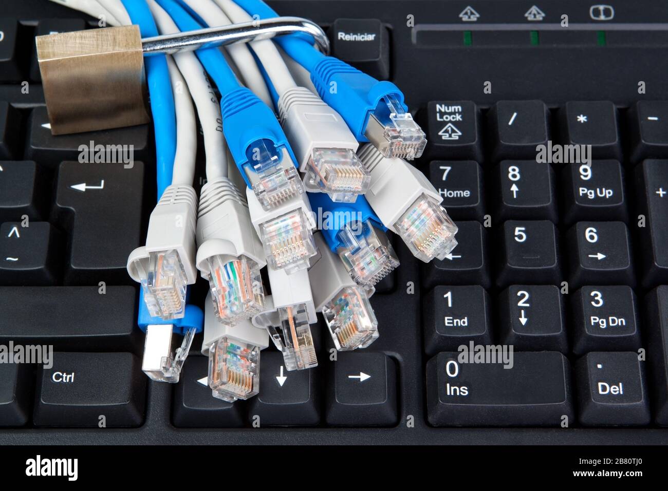 Blocked network cable on the background of the keyboard Stock Photo - Alamy