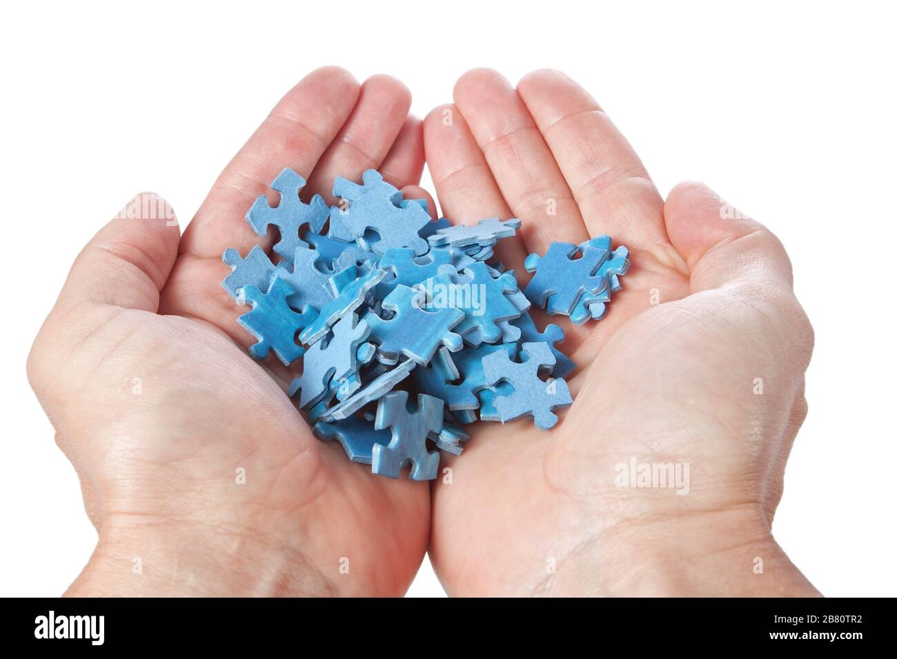 Stack of puzzles palms on a white background Stock Photo - Alamy
