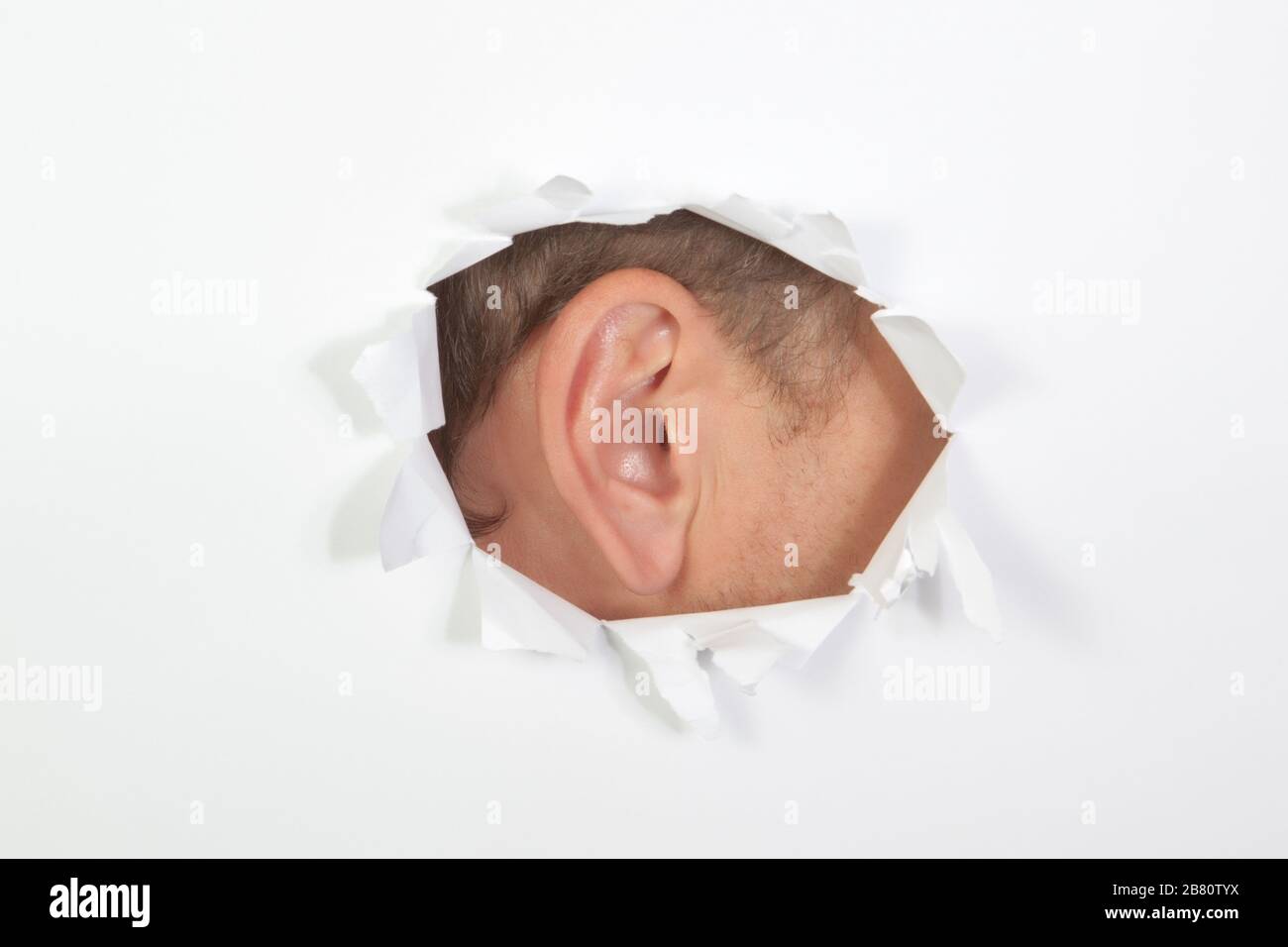 Hole paper ear hi-res stock photography and images - Alamy
