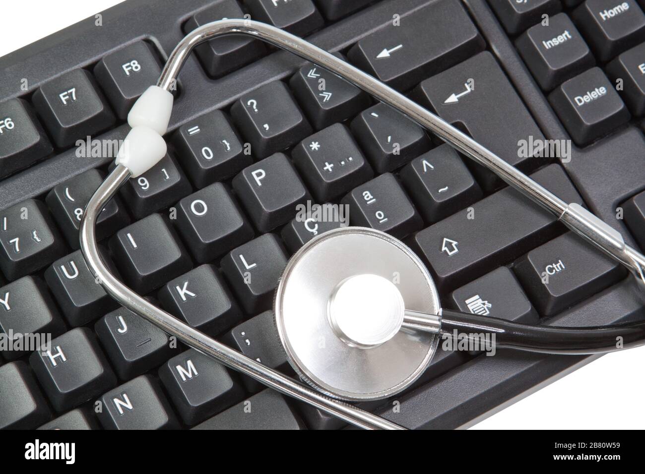 The keyboard for the computer and the elements of a closeup stethoscope ...