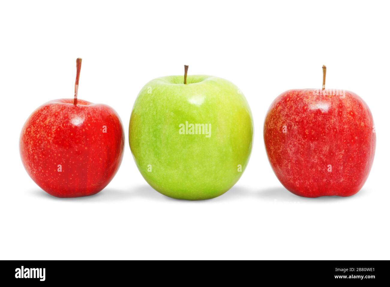 Two red and one green apple. On a white background Stock Photo - Alamy