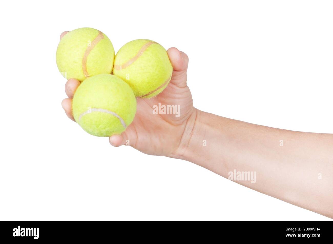 Tennis balls in his hand. On a white background Stock Photo - Alamy