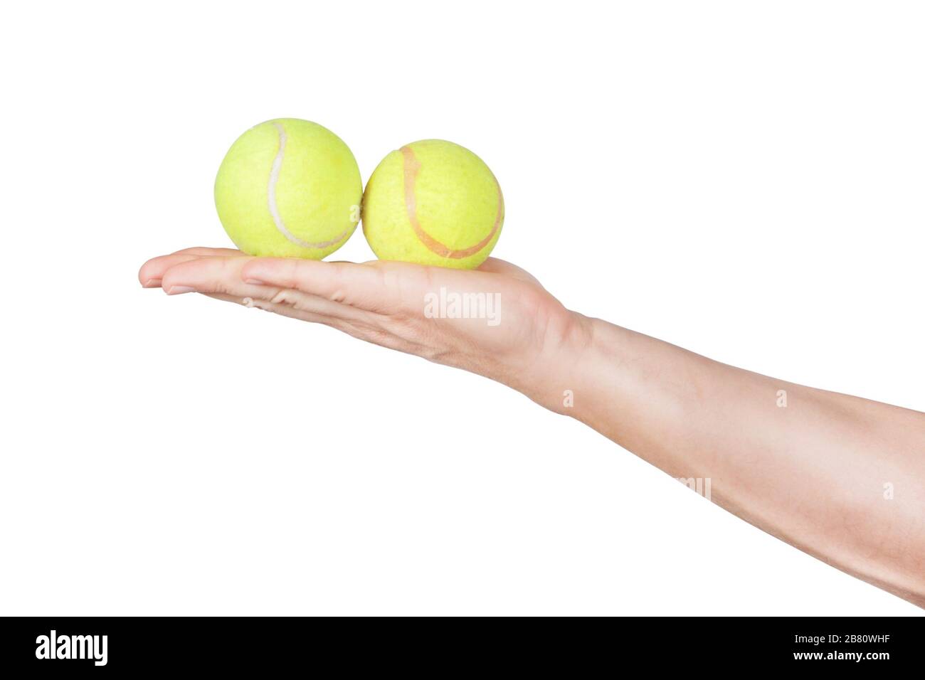 Tennis balls in his hand. On a white background Stock Photo - Alamy