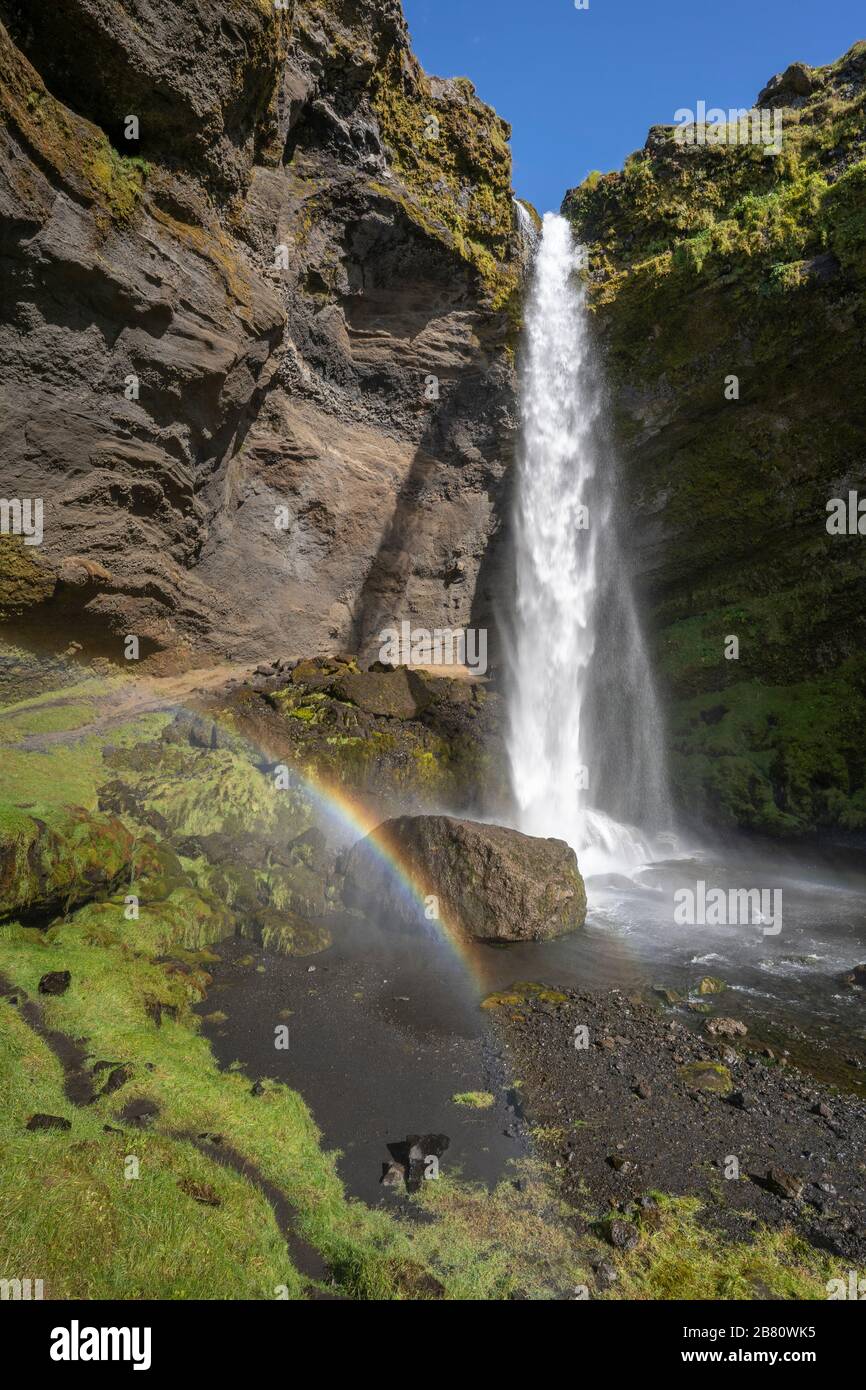 stunning view of the Kvernu Foss waterfall in a hidden valley of south ...
