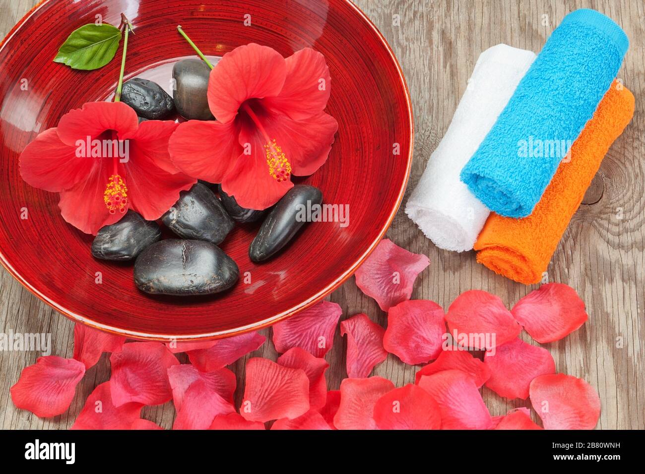 Spa arrangement of flower petals. On a wooden tecture Stock Photo - Alamy