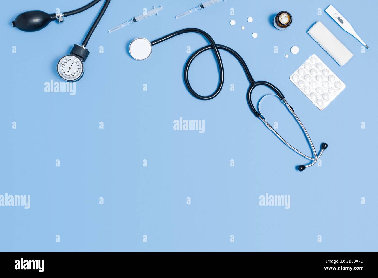 Medical blue background with different accessories: stethoscope ...