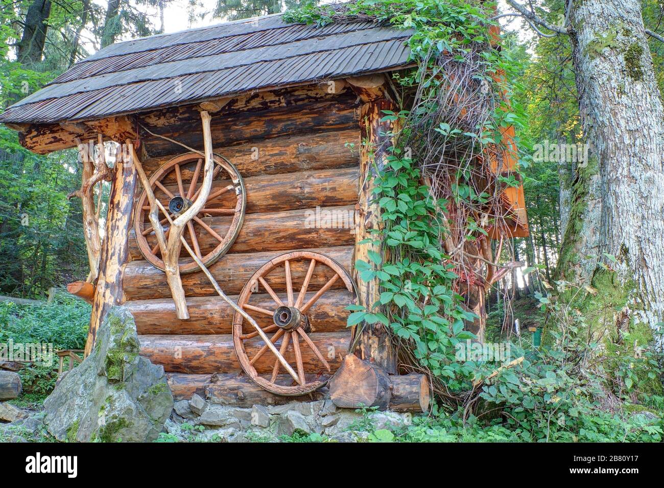 Traditional wooden house made of logs in the forest Stock Photo - Alamy