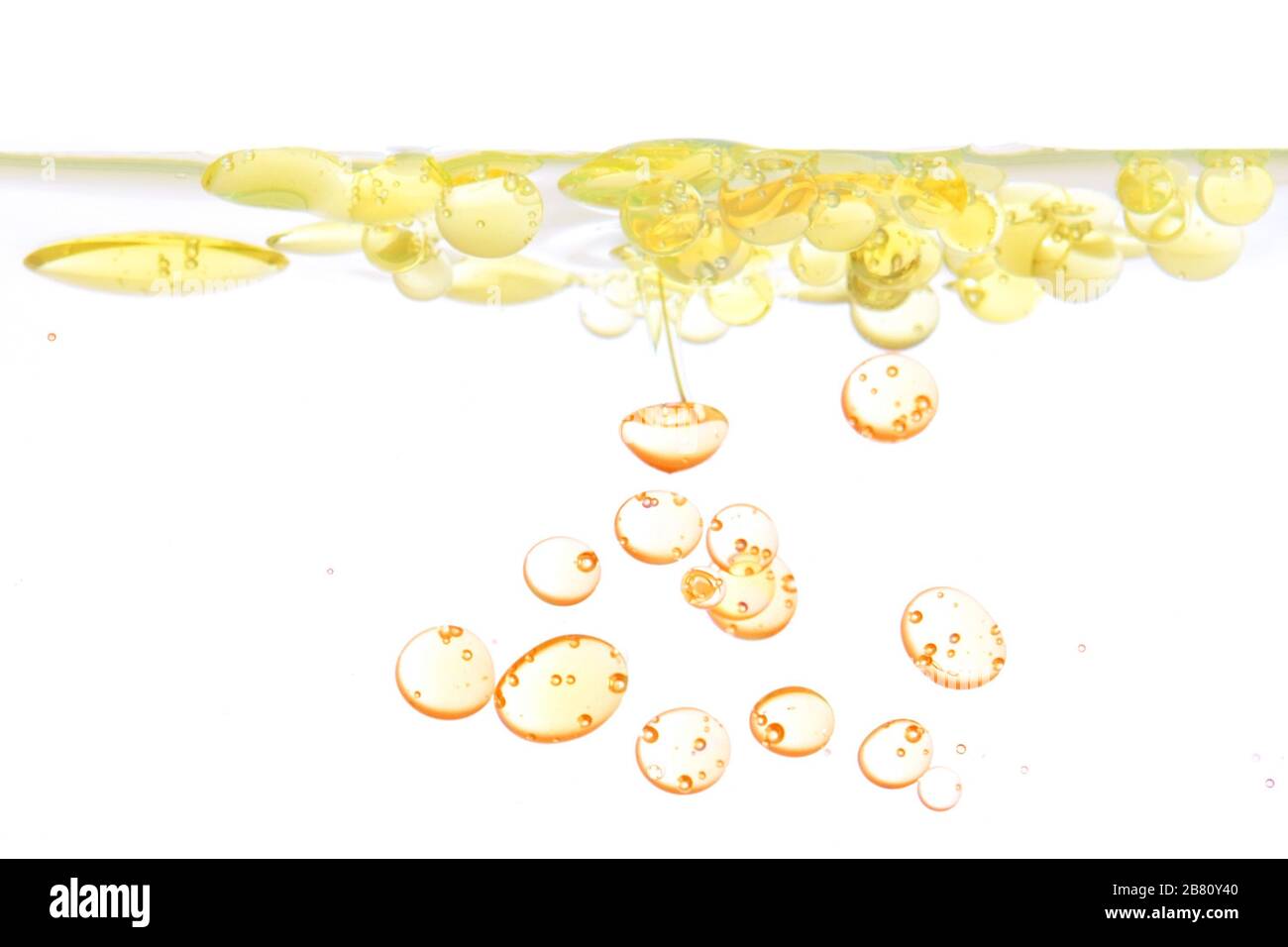 Oil bubbles of oil in water. On a white background Stock Photo - Alamy