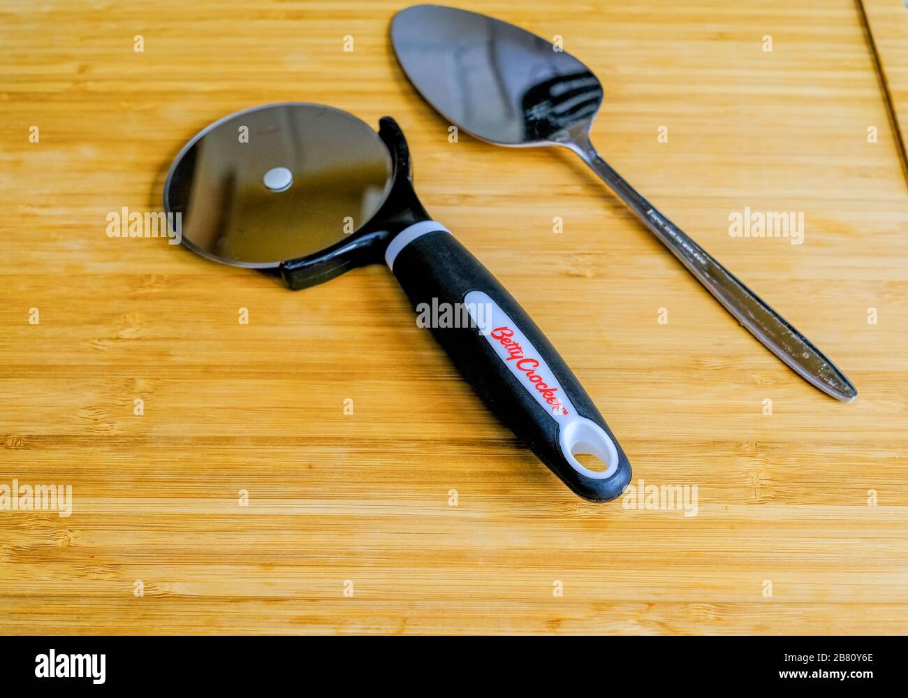 Pizza Wheel and Spatula on Bamboo Cutting Board Stock Photo - Alamy