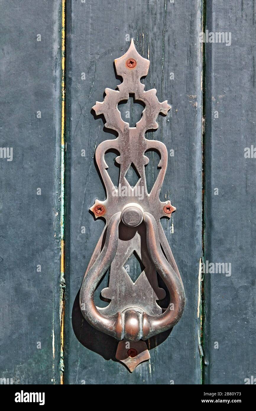 Old ornamental knocker hammer Stock Photo - Alamy