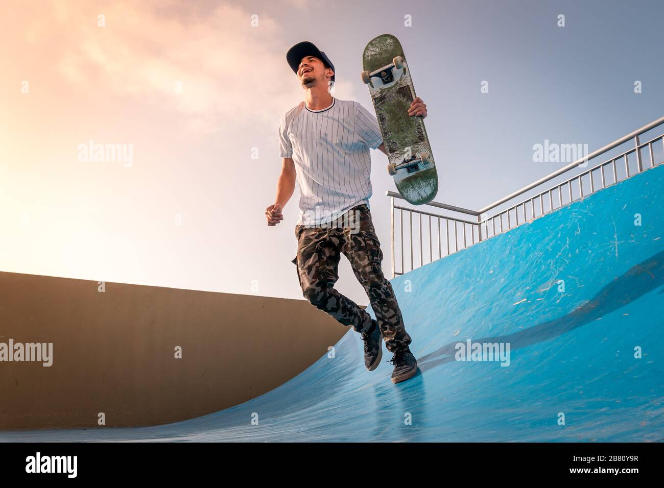 Boy runs skating hi-res stock photography and images - Alamy