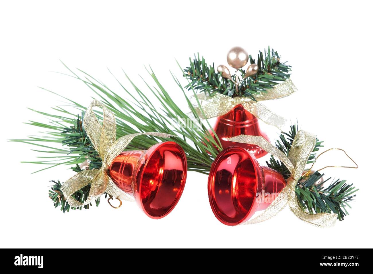 three Christmas bells on a white background Stock Photo - Alamy