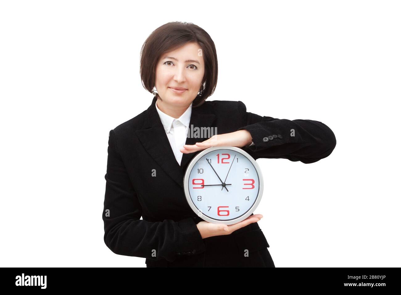 A girl shows a clock on a white background Stock Photo - Alamy