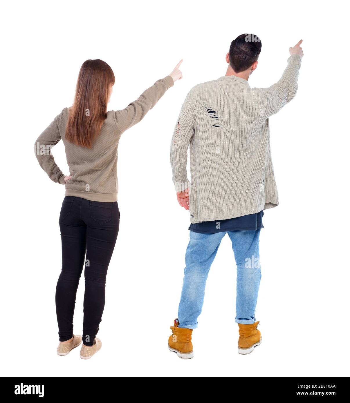 Back view of couple in sweater pointing. Rear view people collection ...