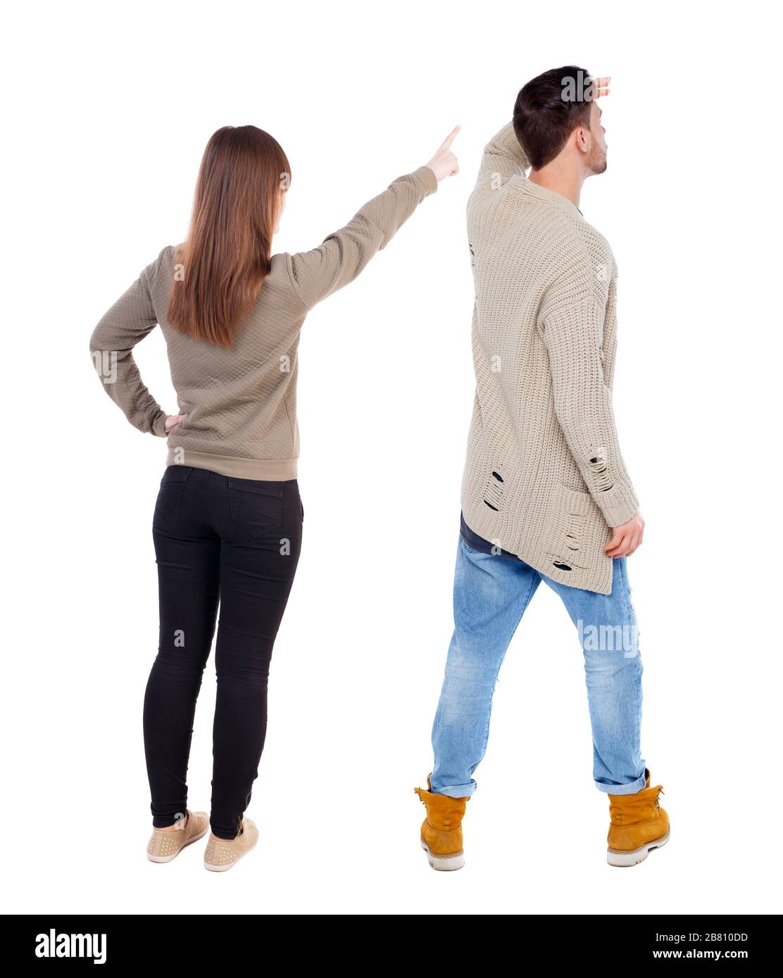 Back view of couple in sweater pointing. Rear view people collection ...