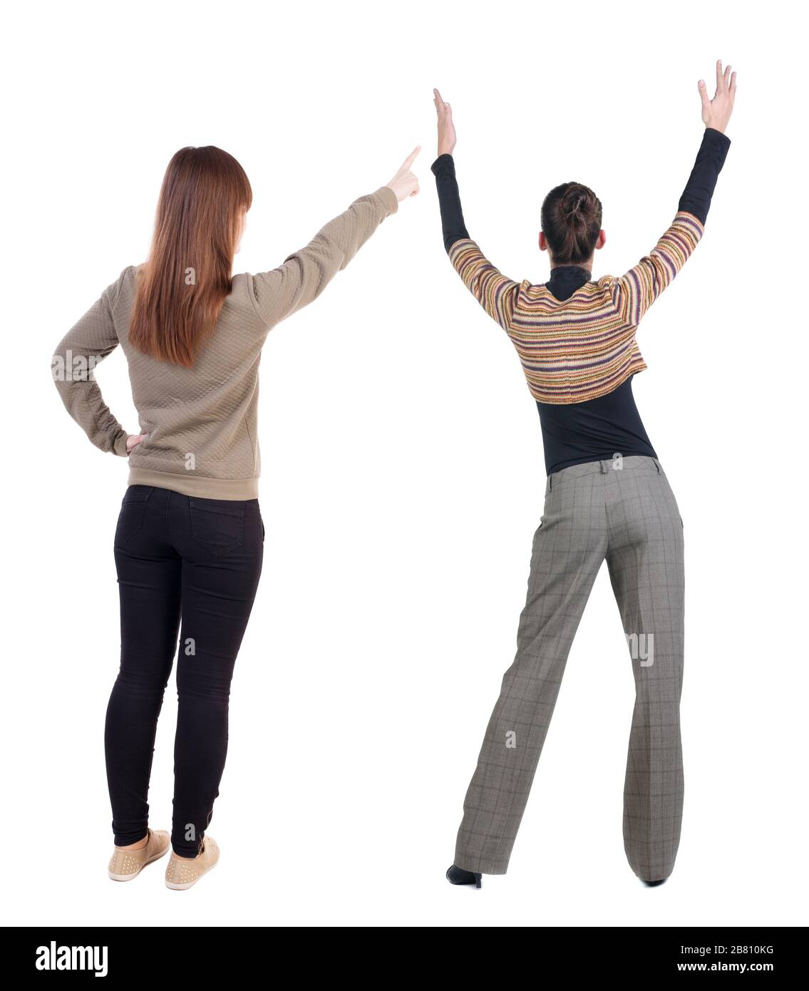 Back view of two pointing girl in sweater. Rear view people collection ...