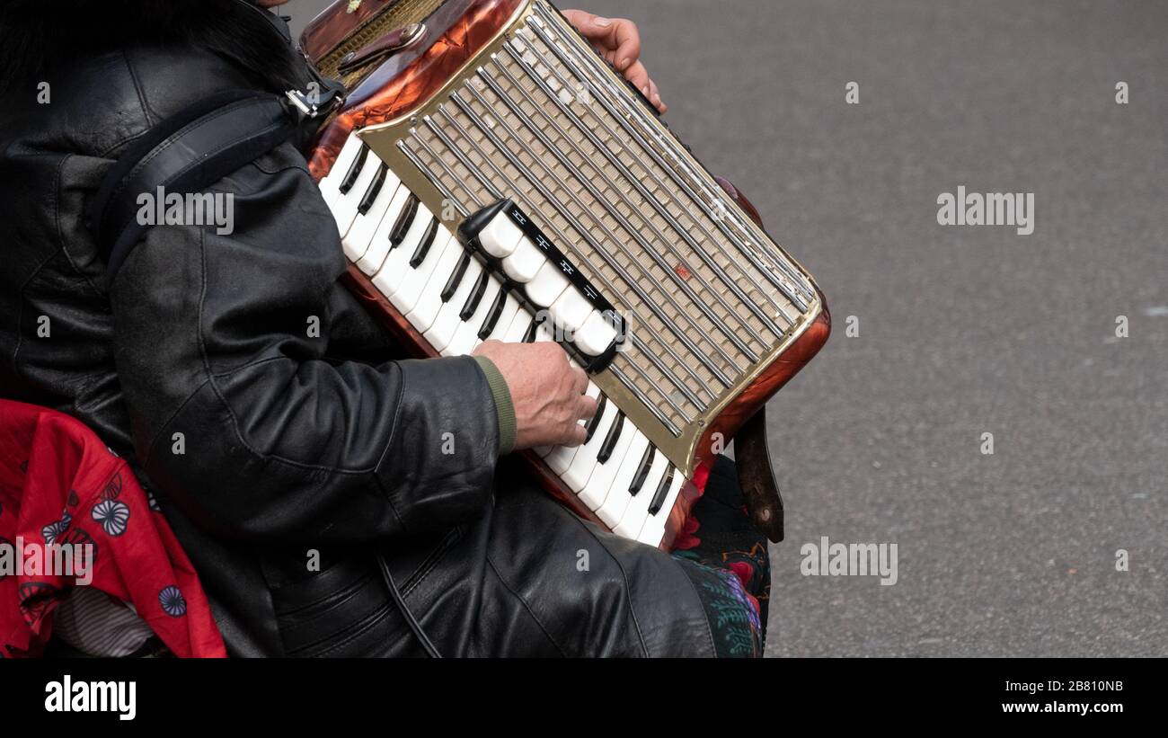 Playing street musician Stock Photo - Alamy