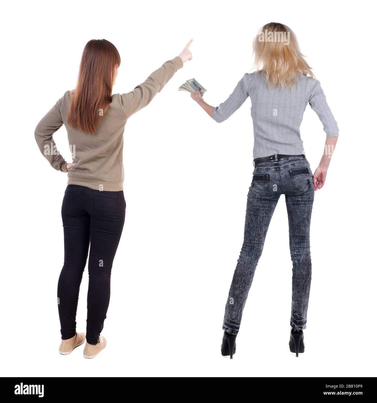 Back view of two pointing girl in sweater. Rear view people collection ...