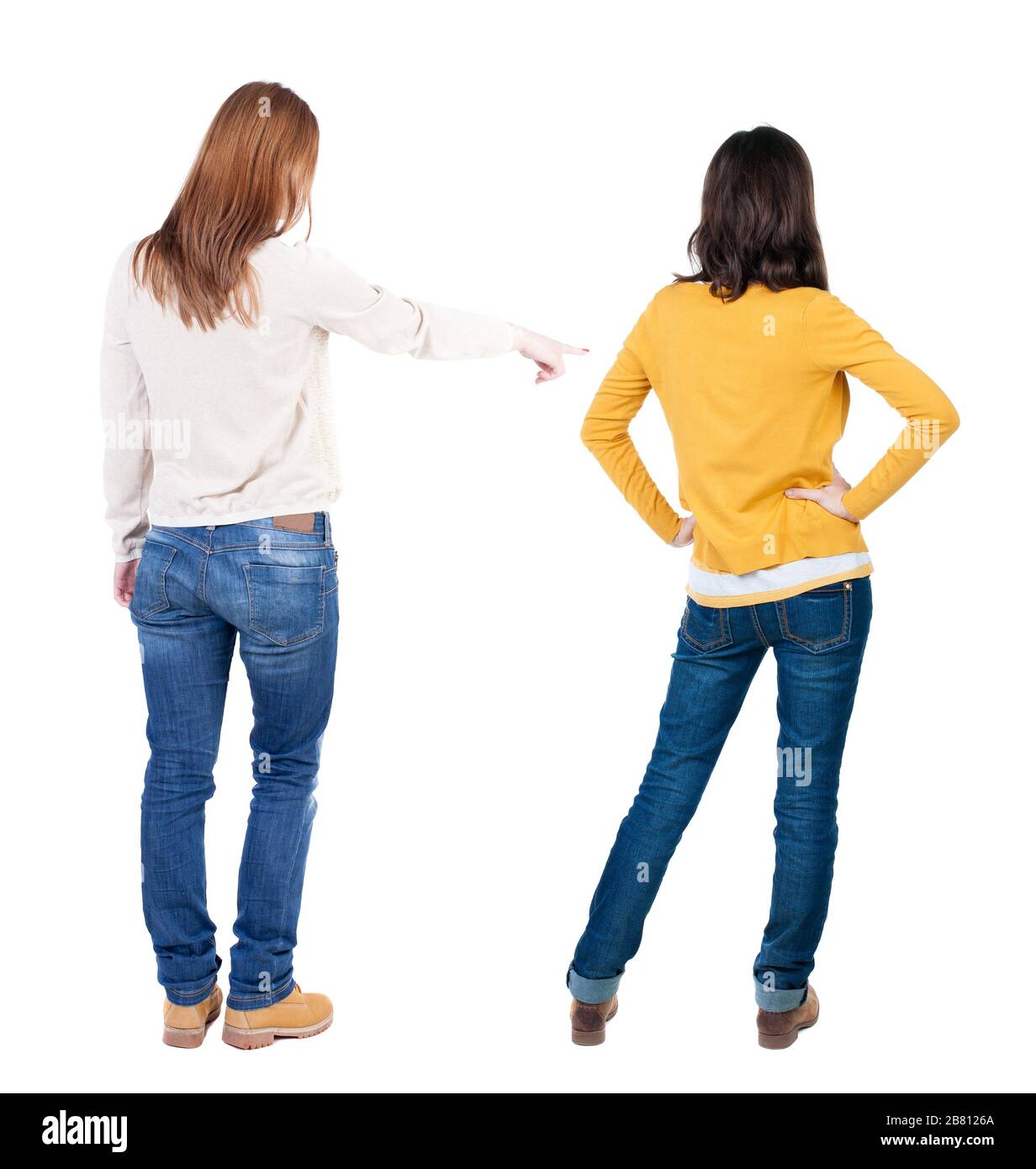 Back view of two pointing girl in sweater. Rear view people collection ...