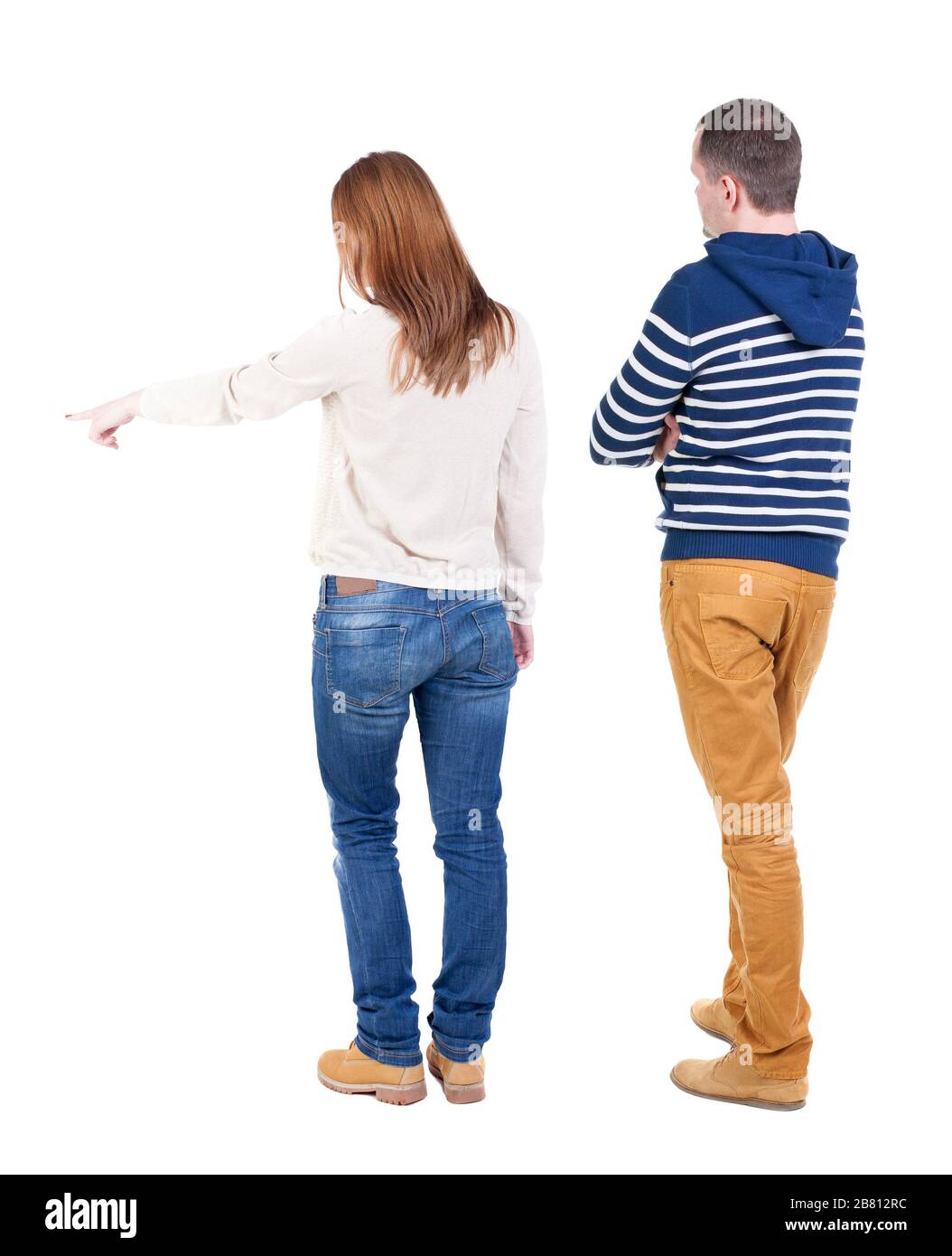 Back view of couple in sweater pointing. Rear view people collection ...