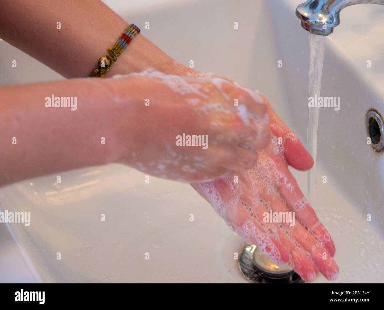 Young woman washing hands hi-res stock photography and images - Alamy