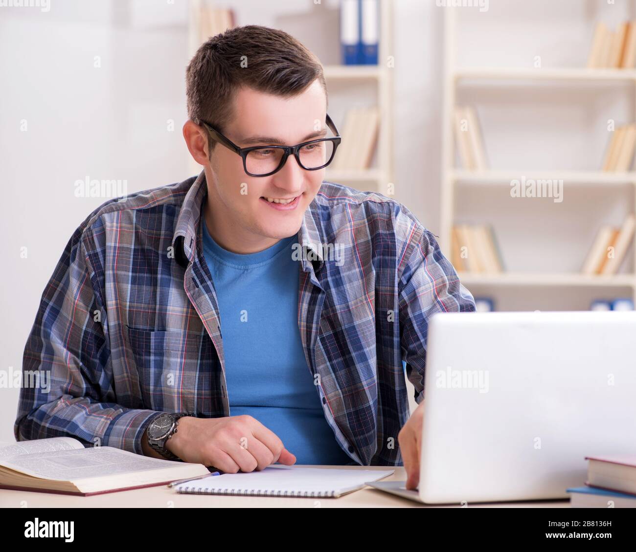 The young student studying over internet in telelearning concept Stock ...