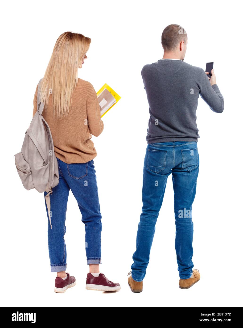 Back view of couple in sweater with mobile phone. beautiful friendly ...