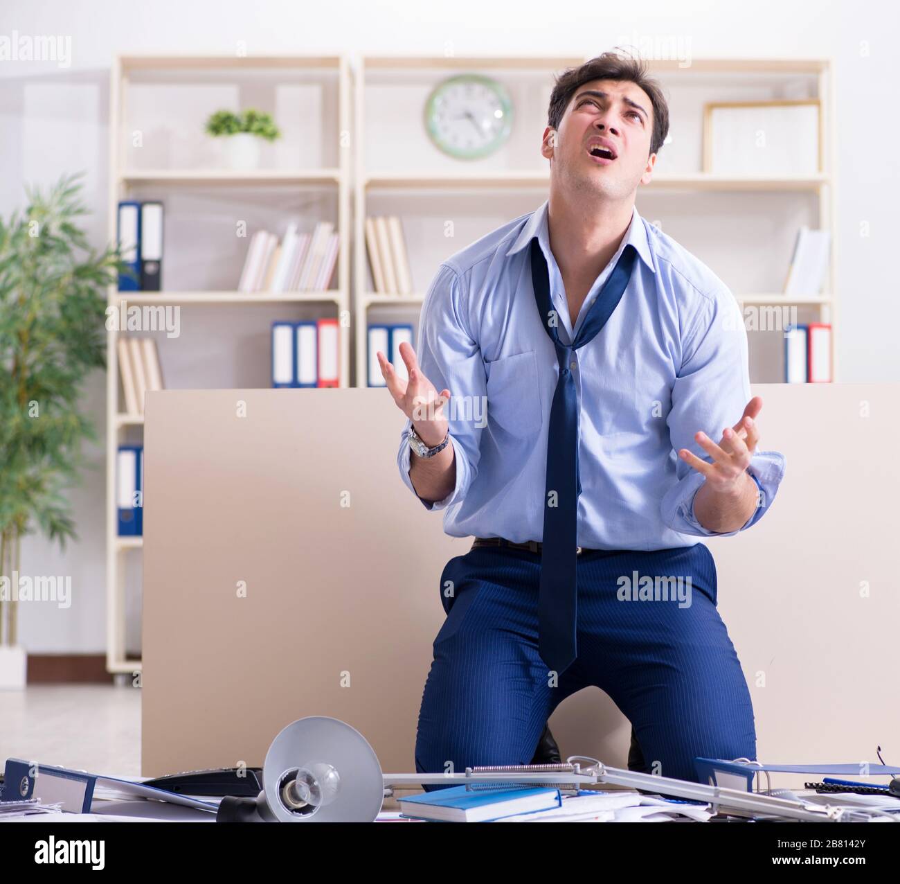 The angry businessman frustrated with too much work Stock Photo - Alamy