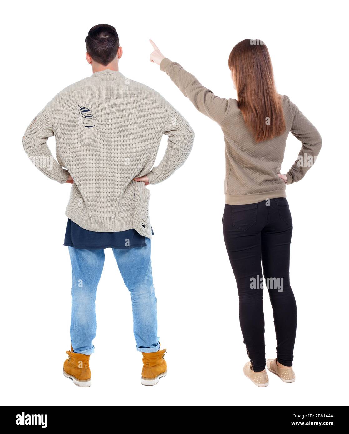 Back view of couple in sweater pointing. Rear view people collection ...
