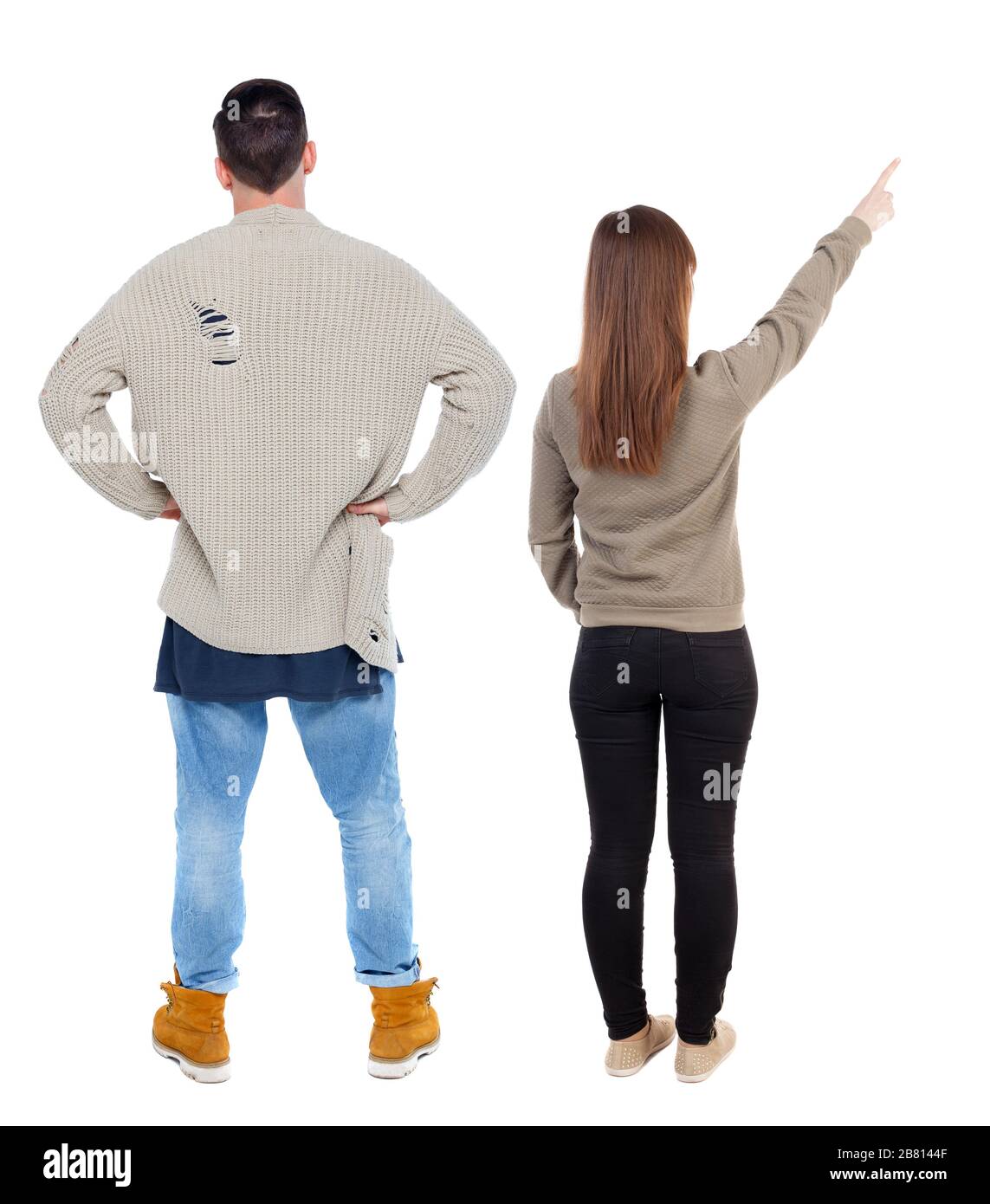 Back view of couple in sweater pointing. Rear view people collection ...
