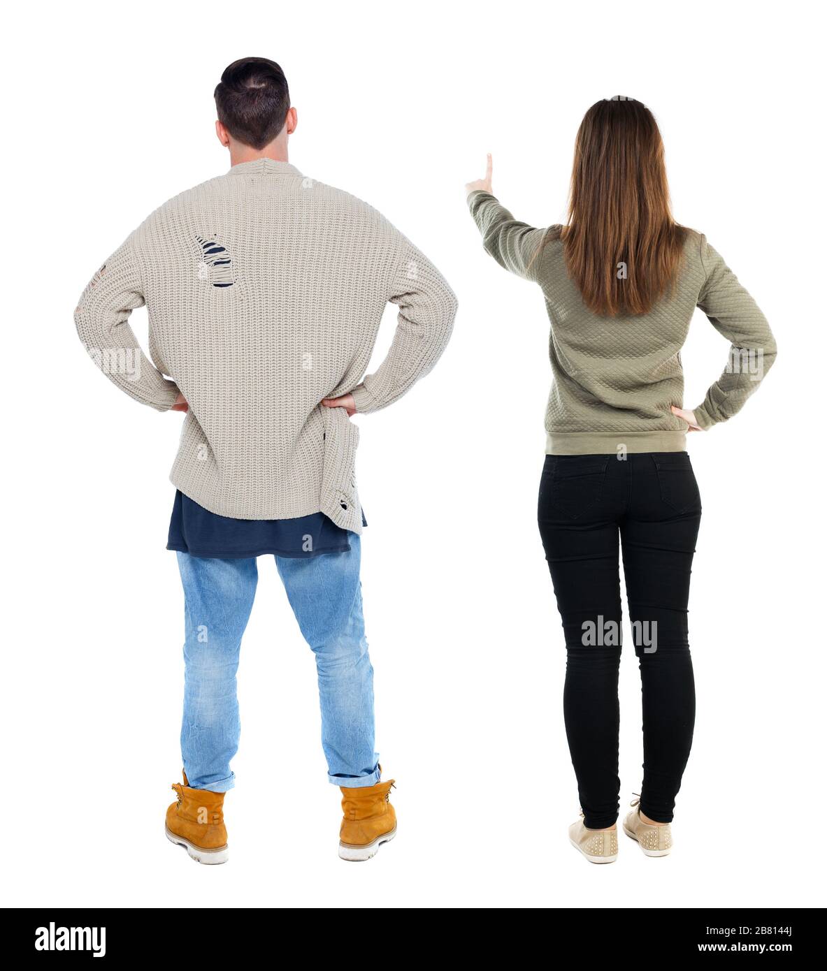 Back view of couple in sweater pointing. Rear view people collection ...