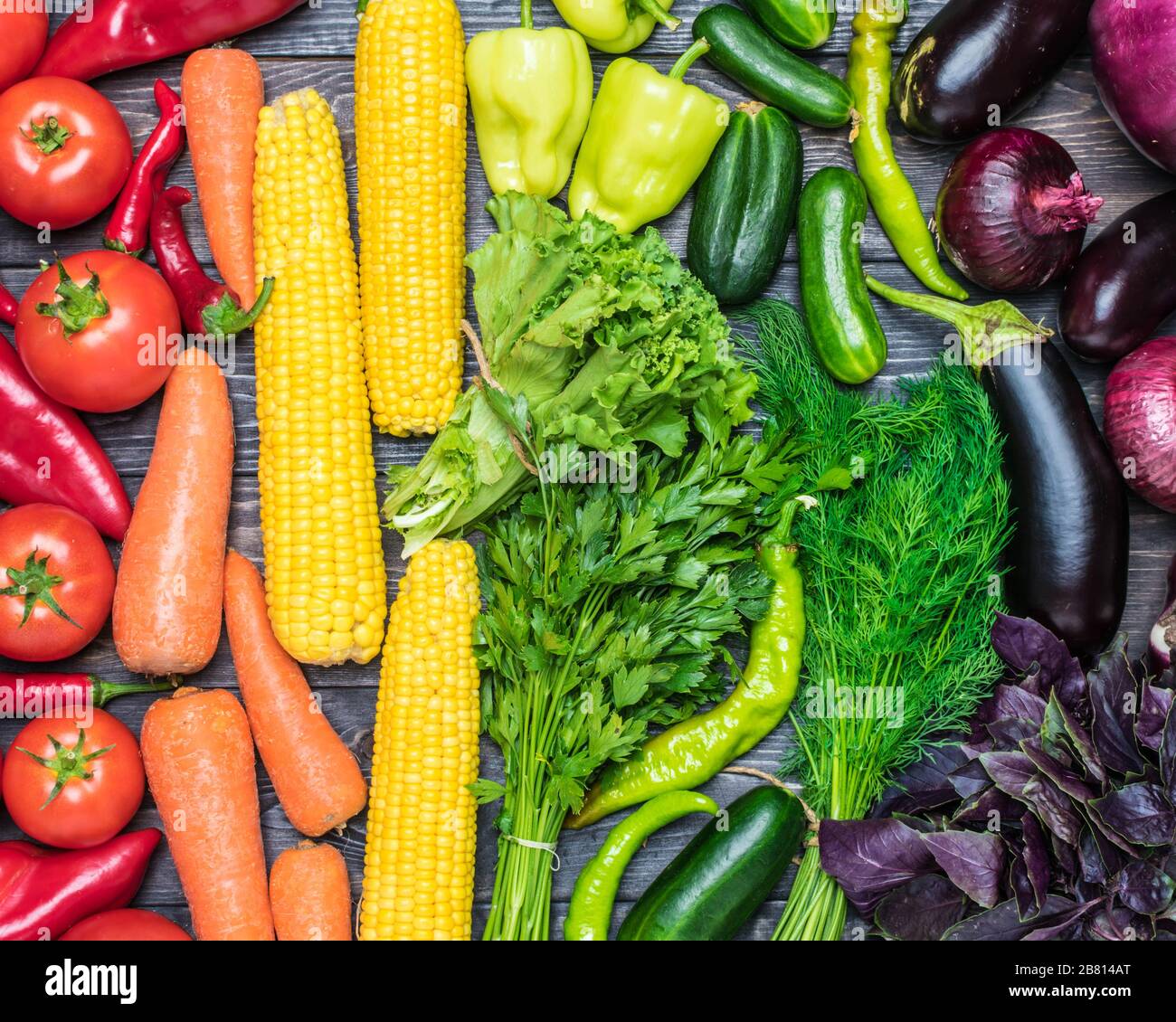 tabletop arrangement of a variety of fresh fruits and vegetables sorted ...