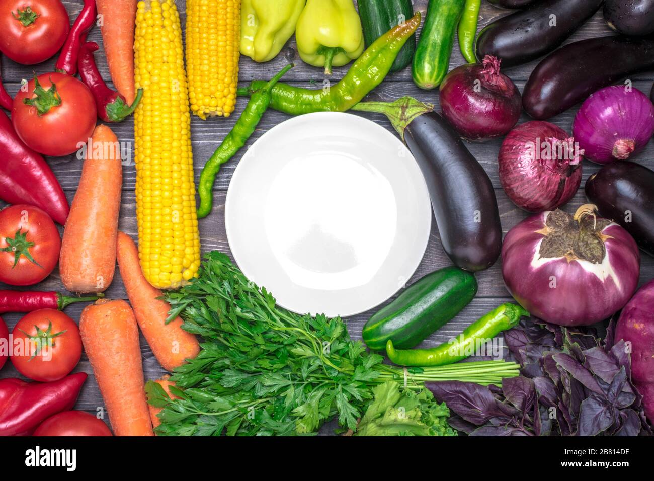 tabletop arrangement of a variety of fresh fruits and vegetables sorted ...