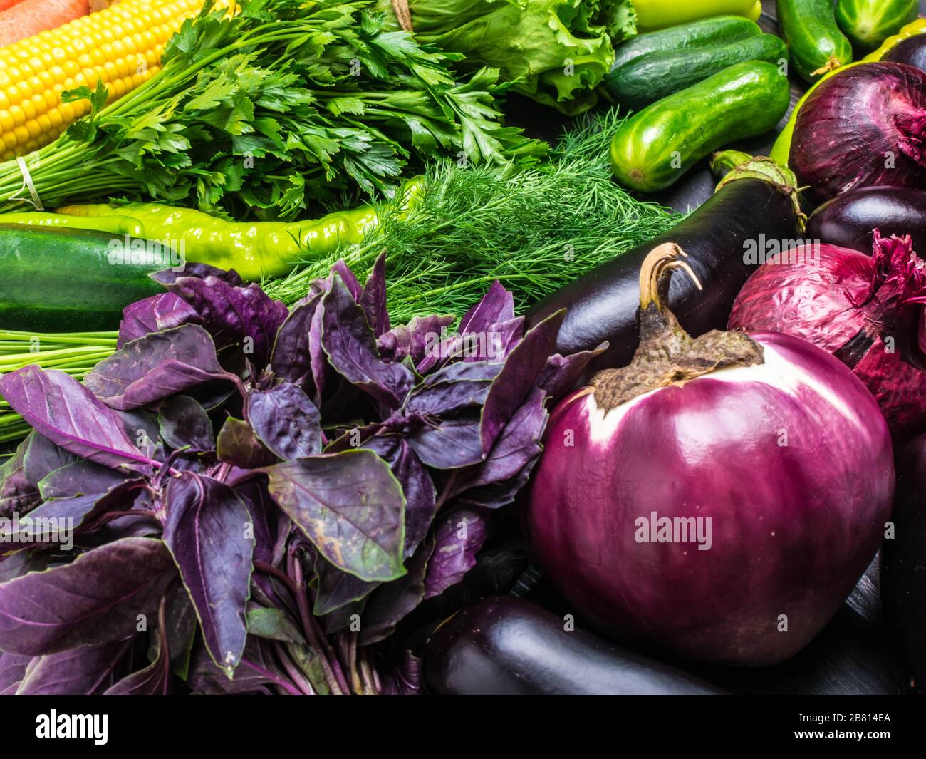 tabletop arrangement of a variety of fresh fruits and vegetables sorted ...