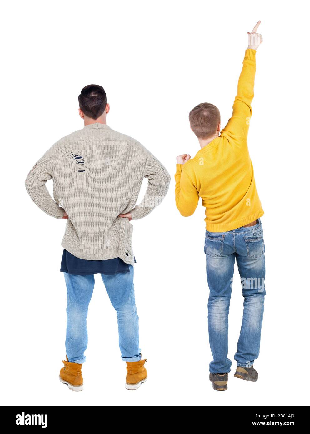 Back view of couple in sweater pointing. Rear view people collection ...