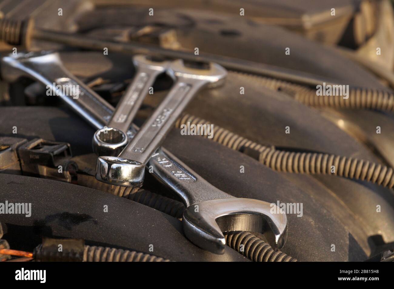 Wrenches for repair lying in the engine compartment. Car repair ...