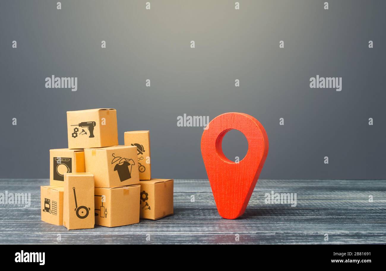 Red location pointer geolocation symbol and cardboard boxes. Global ...