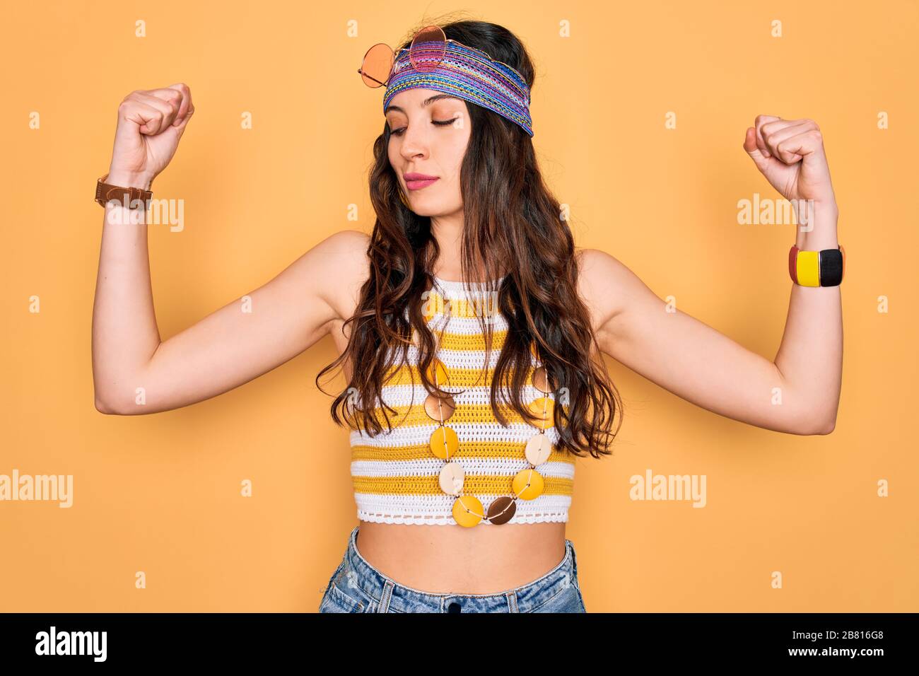 Young beautiful hippie woman with blue eyes wearing accesories and ...