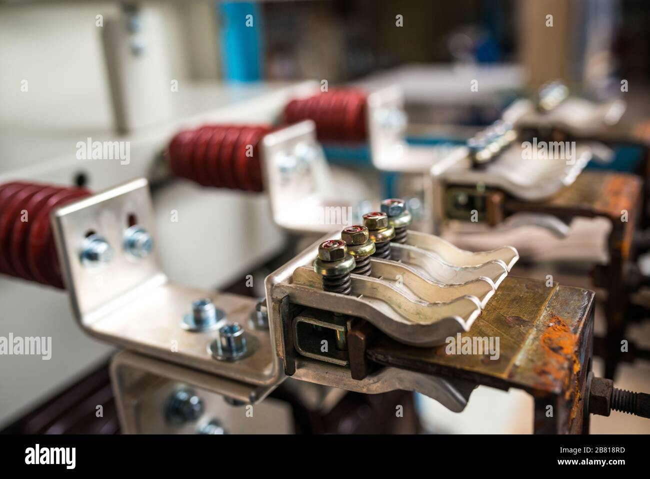 Three copper high voltage terminals with ceramic cylinders and ...