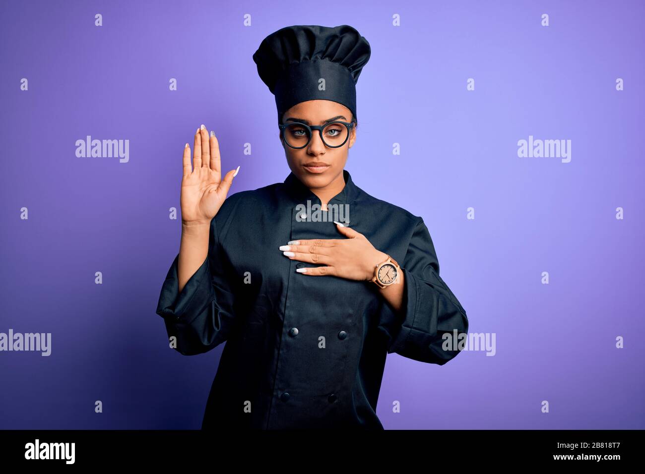 Young african american chef girl wearing cooker uniform and hat over ...